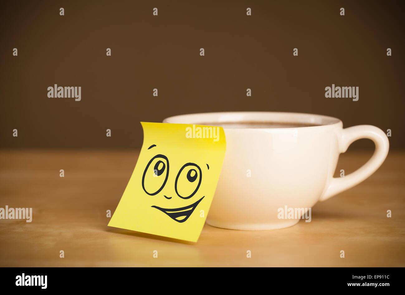Post-it note with smiley face sticked on cup Stock Photo - Alamy