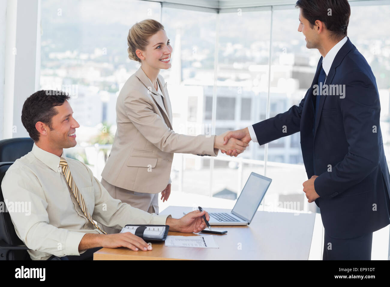 Business people shaking hands with their future patner Stock Photo - Alamy