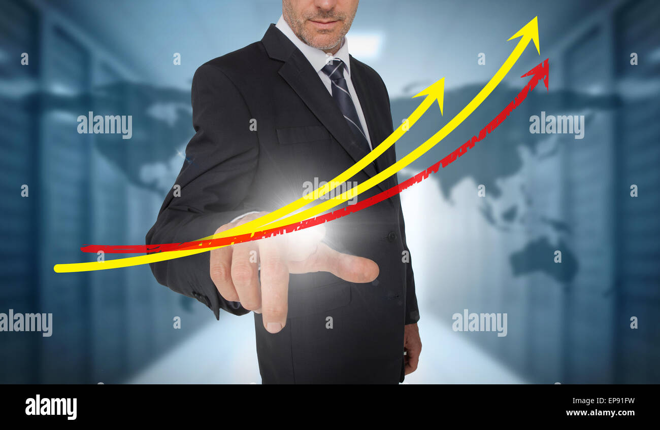 Businessman touching red and yellow growth lines with world map on ...
