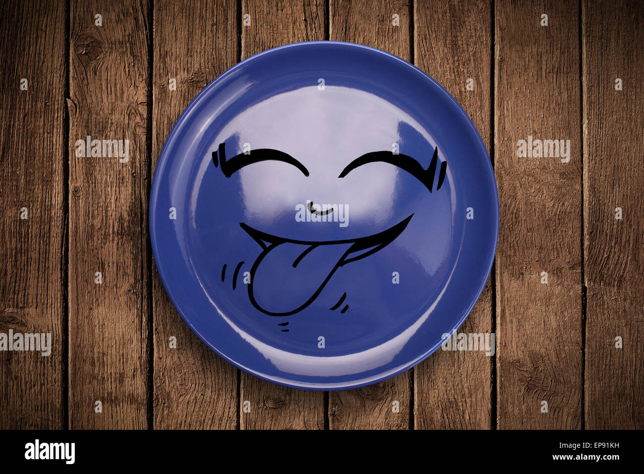 Happy smiley cartoon face on colorful dish plate Stock Photo - Alamy