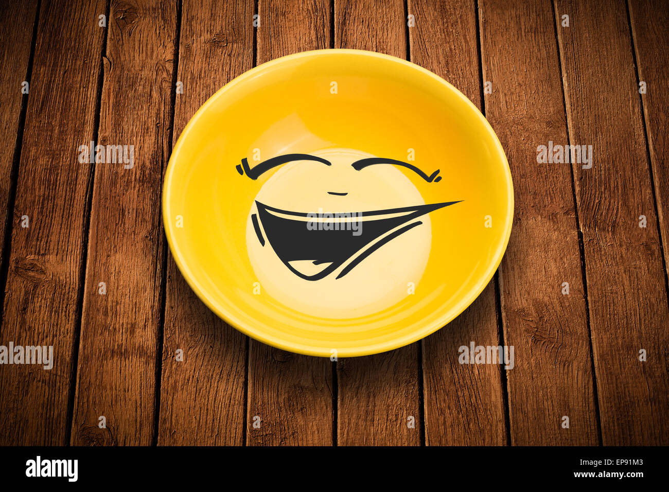 Happy smiley cartoon face on colorful dish plate Stock Photo - Alamy
