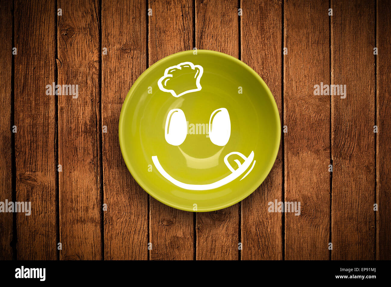 Happy smiley cartoon face on colorful dish plate Stock Photo - Alamy