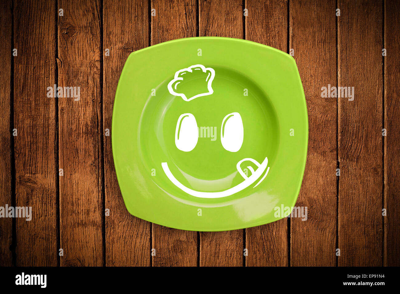 Happy smiley cartoon face on colorful dish plate Stock Photo - Alamy