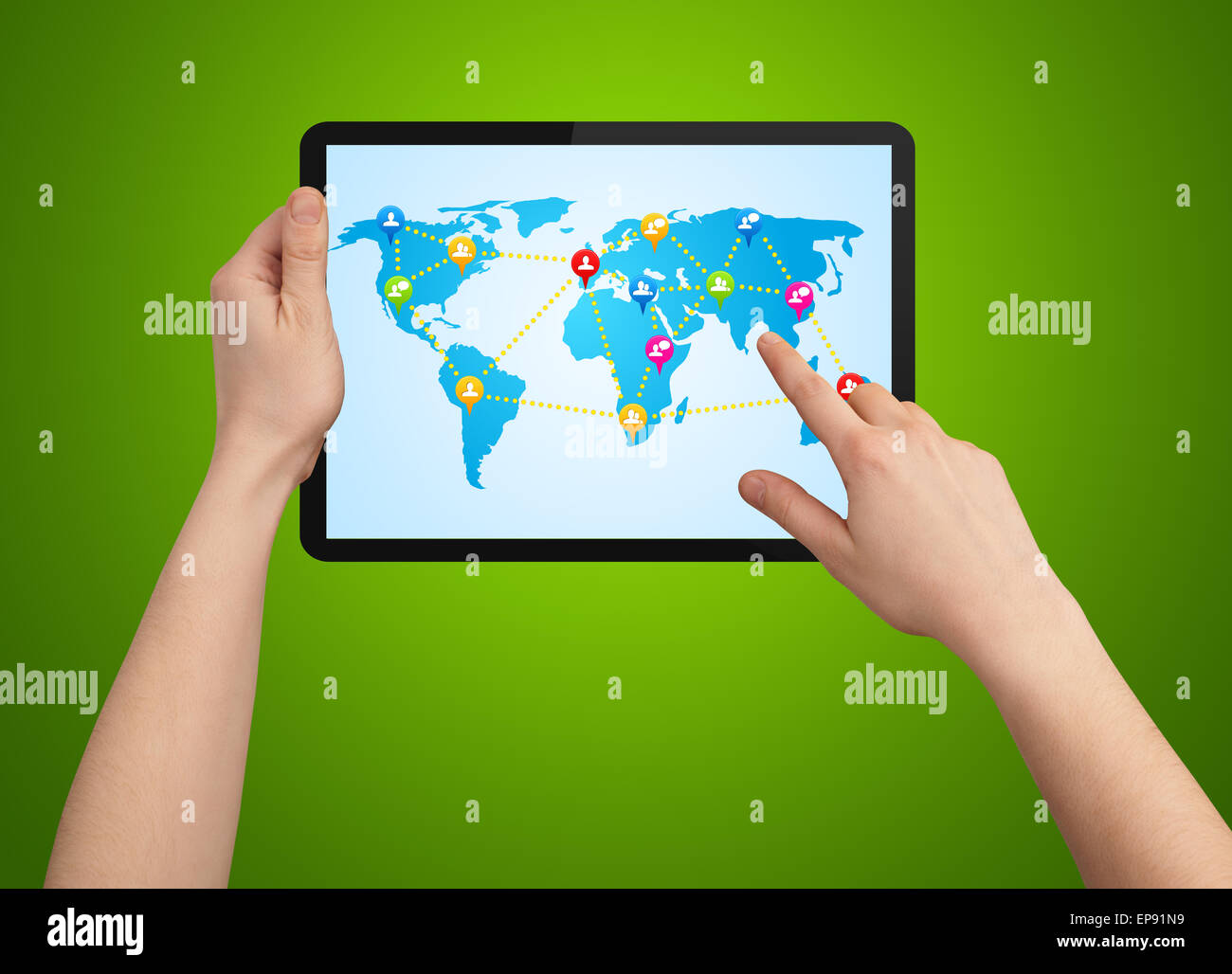 A male hand holding a modern touchpad with social map Stock Photo - Alamy