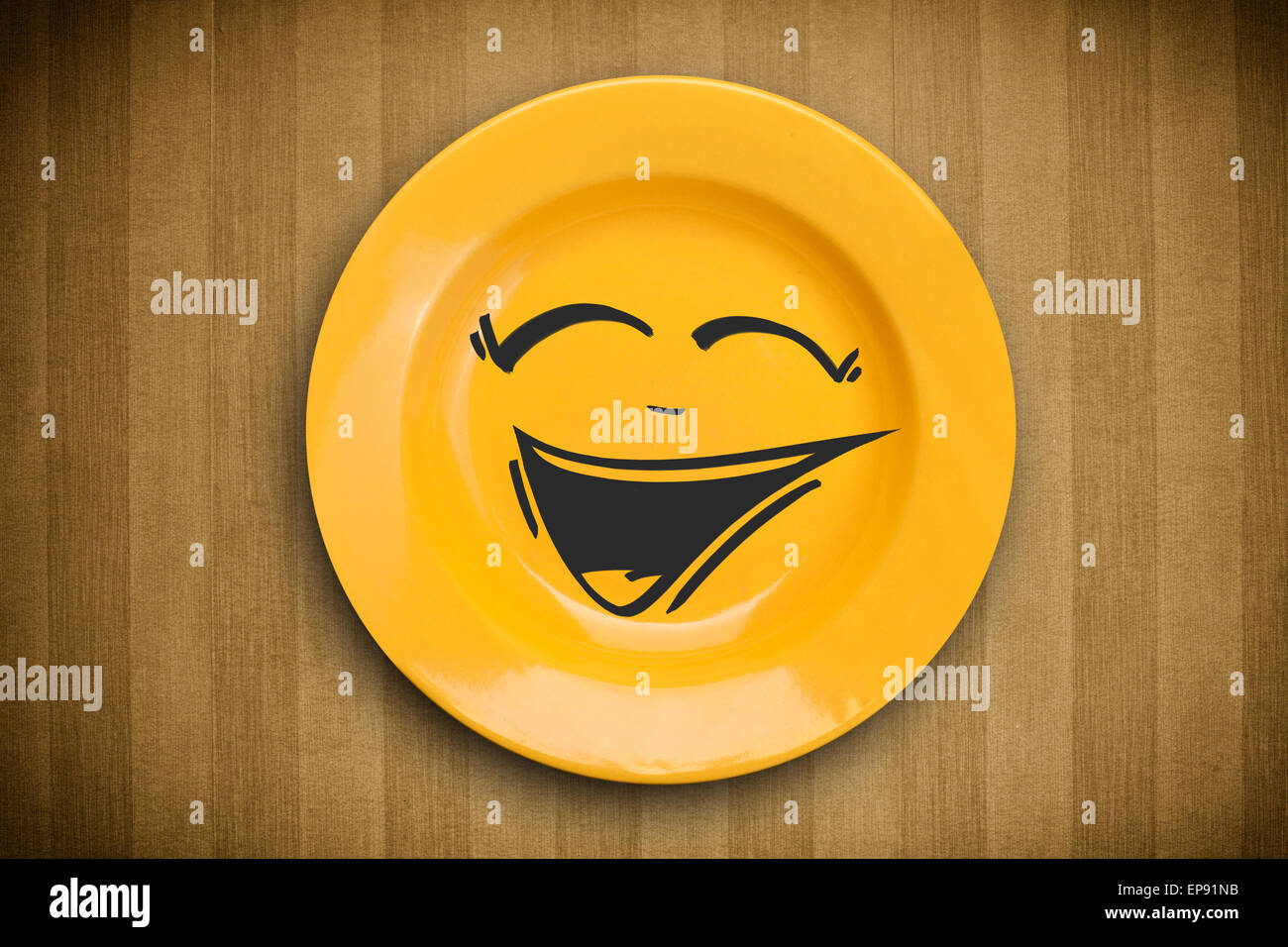 Happy smiley cartoon face on colorful dish plate Stock Photo - Alamy