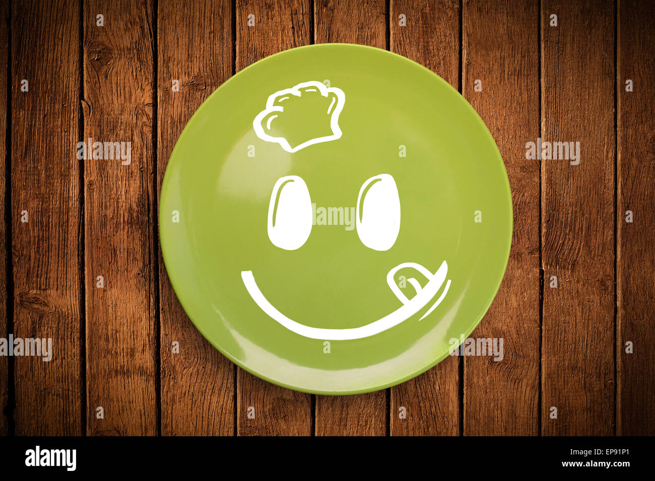 Happy smiley cartoon face on colorful dish plate Stock Photo - Alamy