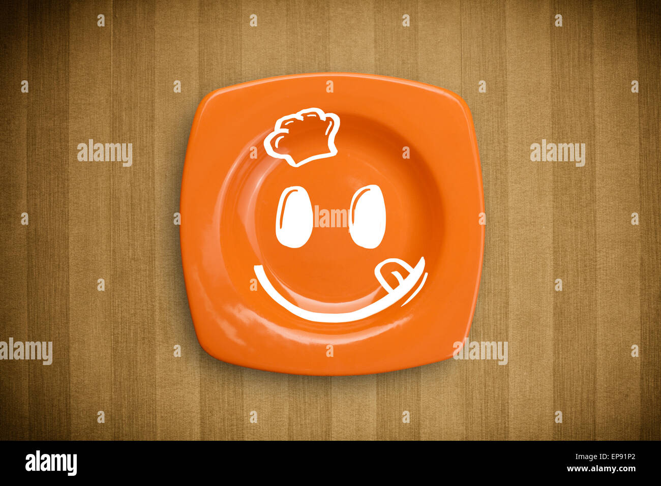 Happy smiley cartoon face on colorful dish plate Stock Photo - Alamy