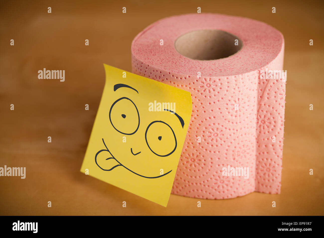 Post-it note with smiley face sticked on a toilet paper Stock Photo - Alamy