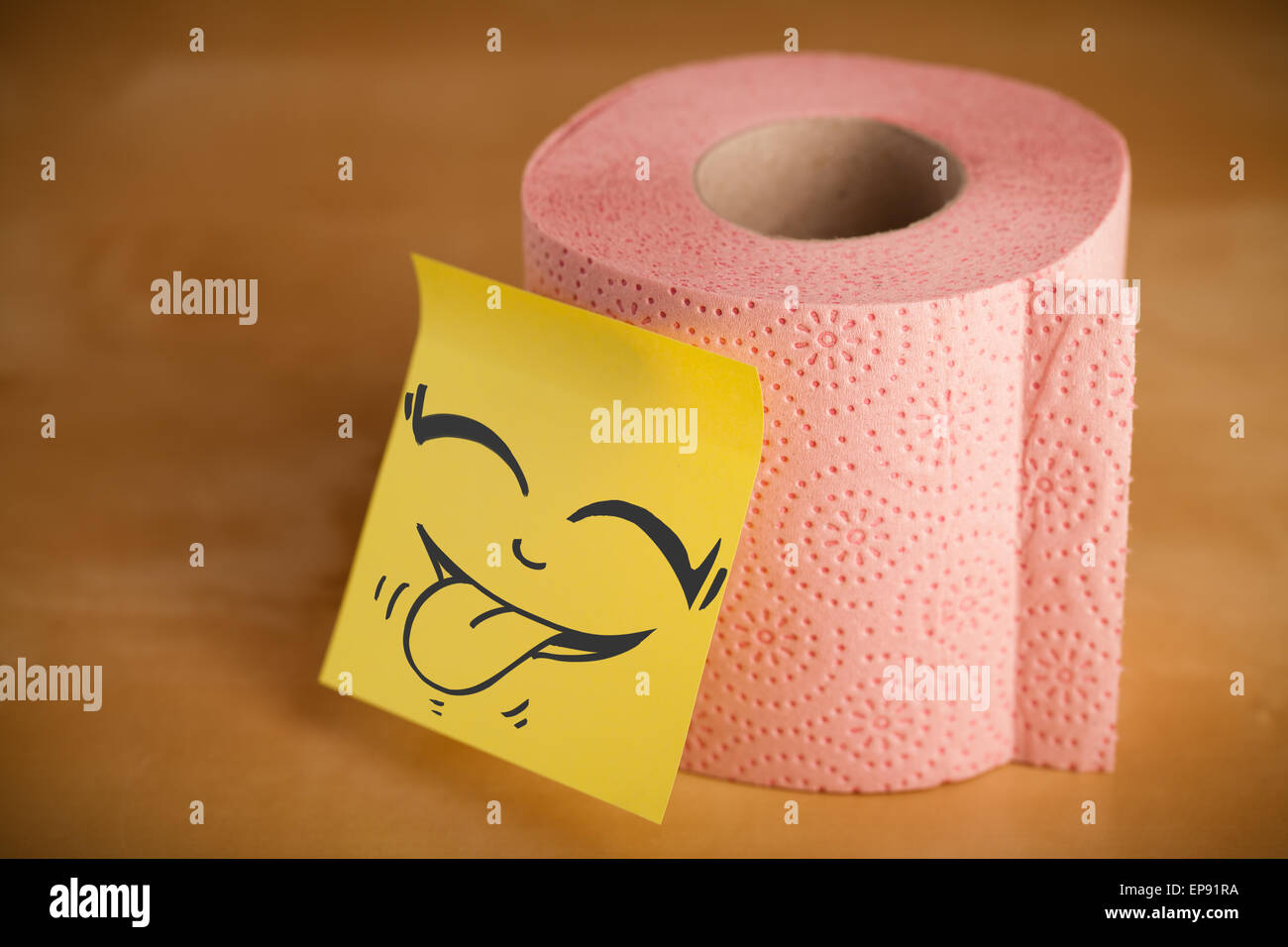 Post-it note with smiley face sticked on a toilet paper Stock Photo - Alamy