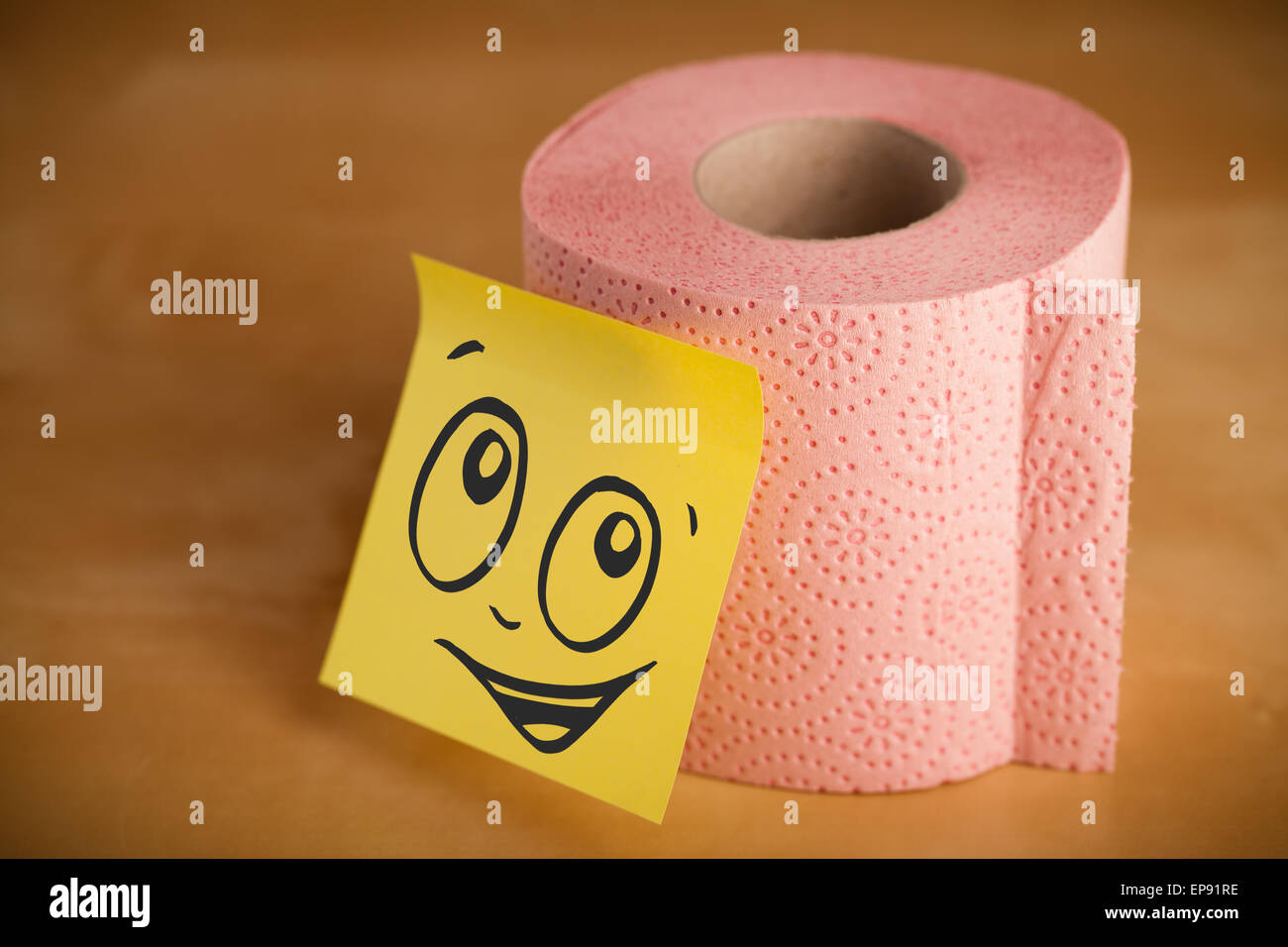 Post-it note with smiley face sticked on toilet paper Stock Photo - Alamy