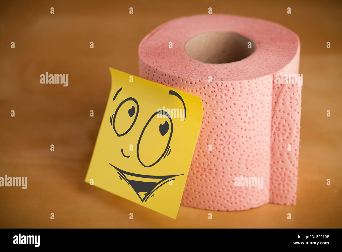 Post-it note with smiley face sticked on toilet paper Stock Photo - Alamy