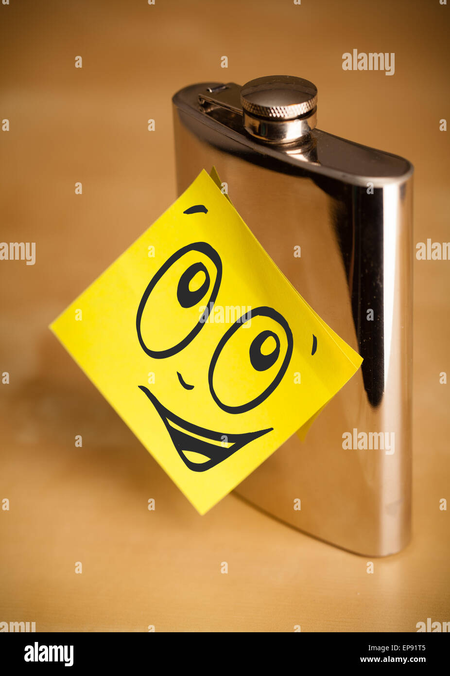 Post-it note with smiley face sticked on hip flask Stock Photo - Alamy