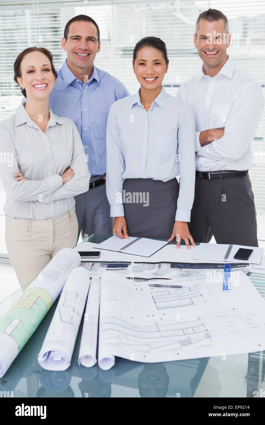 Happy architects posing while working together Stock Photo - Alamy