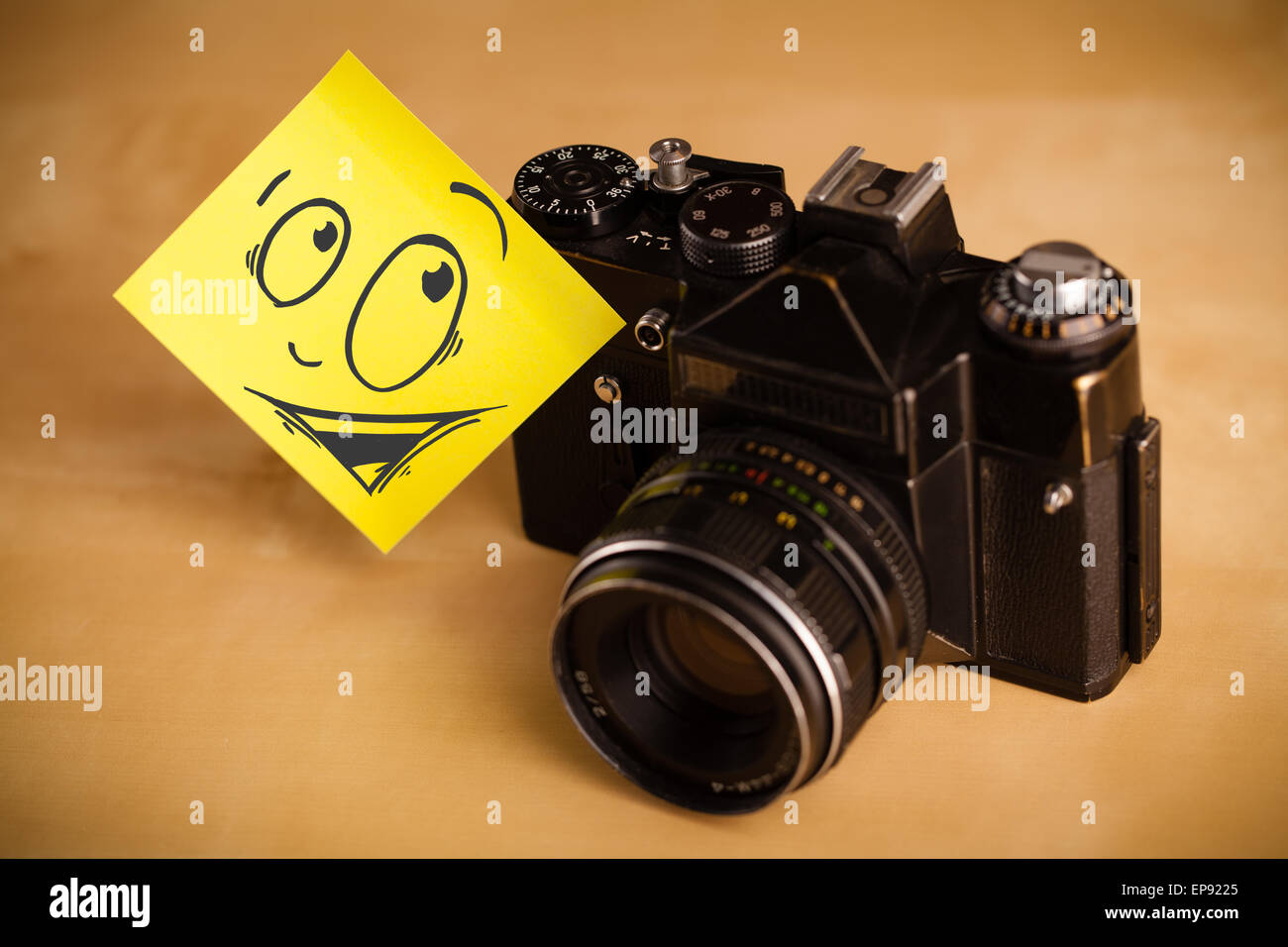 Post-it note with smiley face sticked on photo camera Stock Photo - Alamy