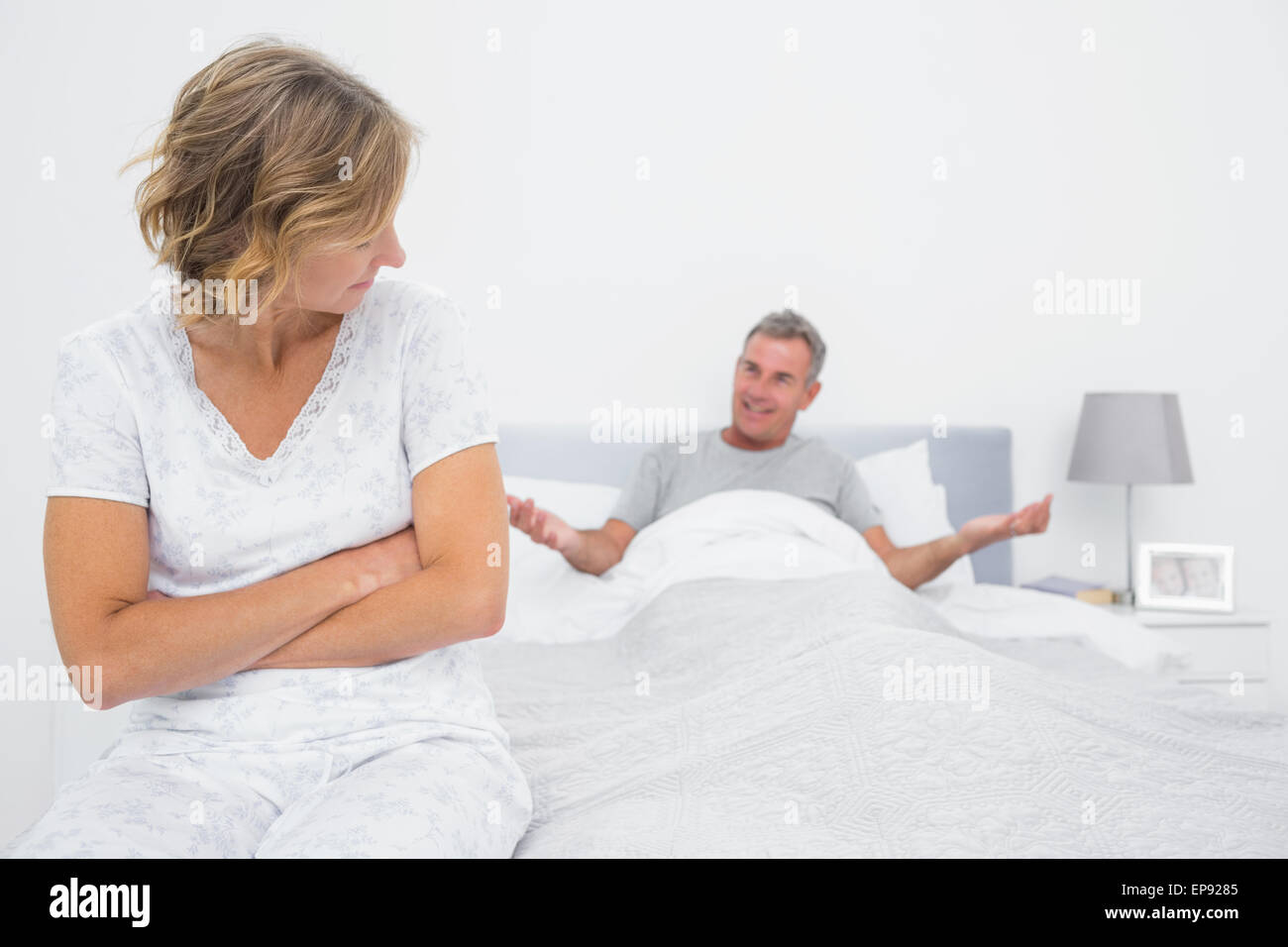 Angry woman looking at husband gesturing during a fight Stock Photo - Alamy