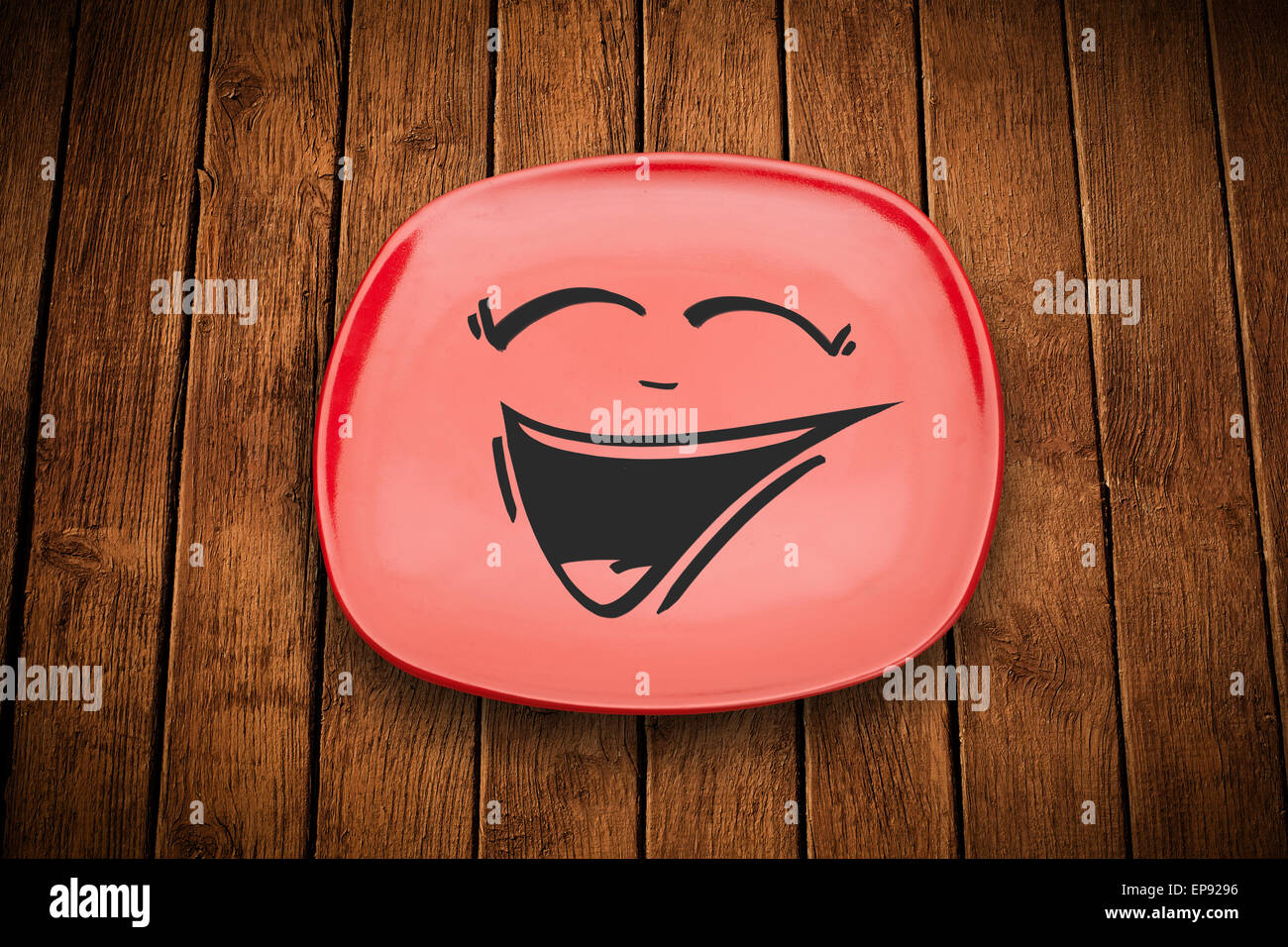 Happy smiley cartoon face on colorful dish plate Stock Photo - Alamy