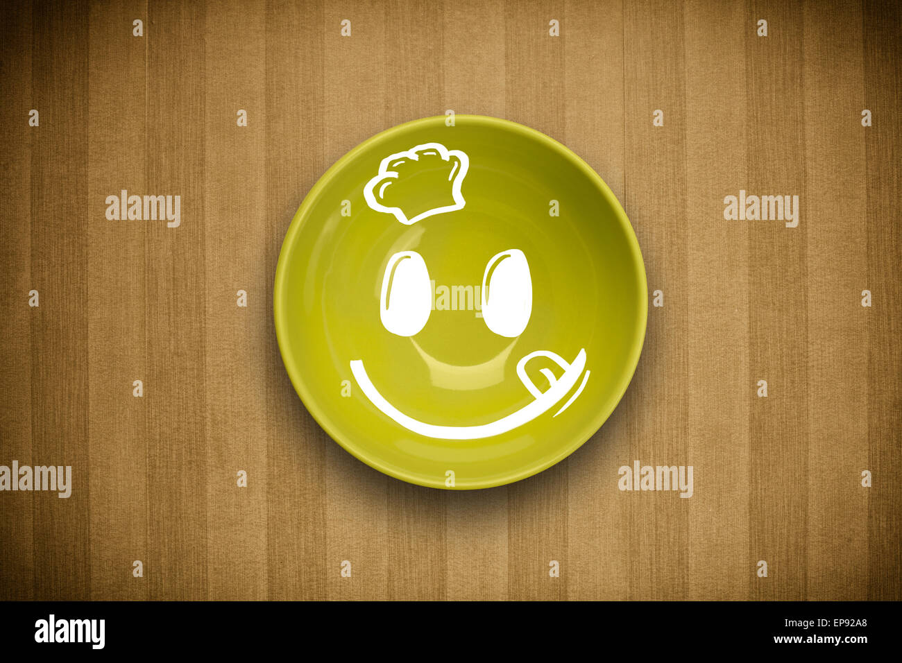Happy smiley cartoon face on colorful dish plate Stock Photo - Alamy