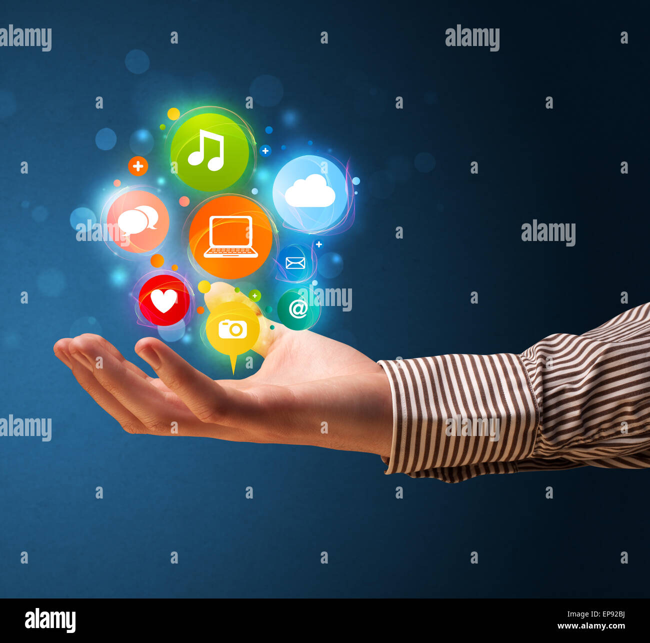 Multimedia icons in the hand of a businessman Stock Photo - Alamy