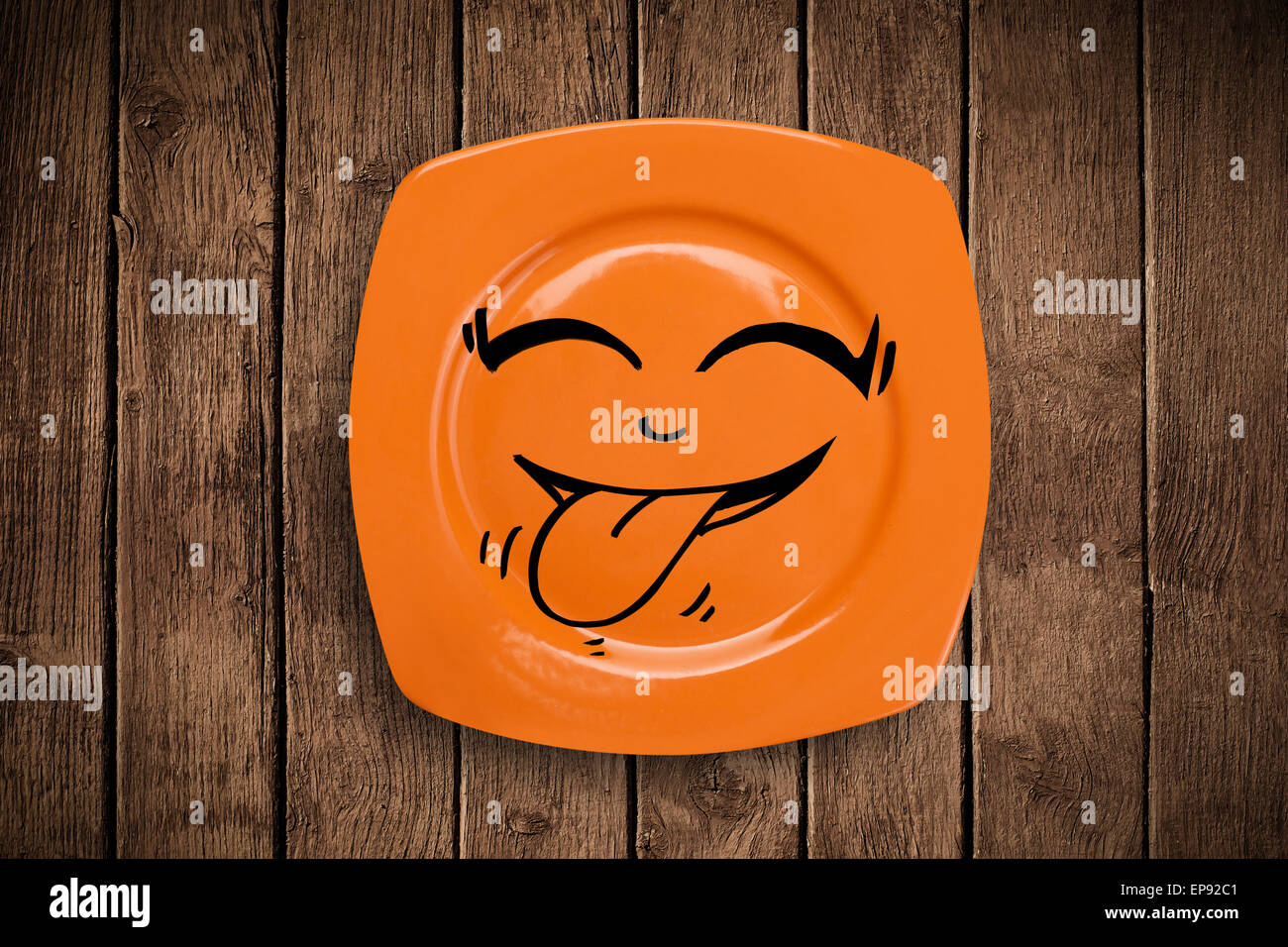 Happy smiley cartoon face on colorful dish plate Stock Photo - Alamy
