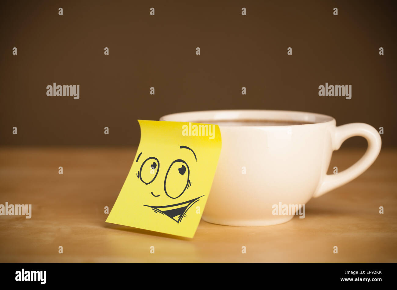 Post-it note with smiley face sticked on cup Stock Photo - Alamy