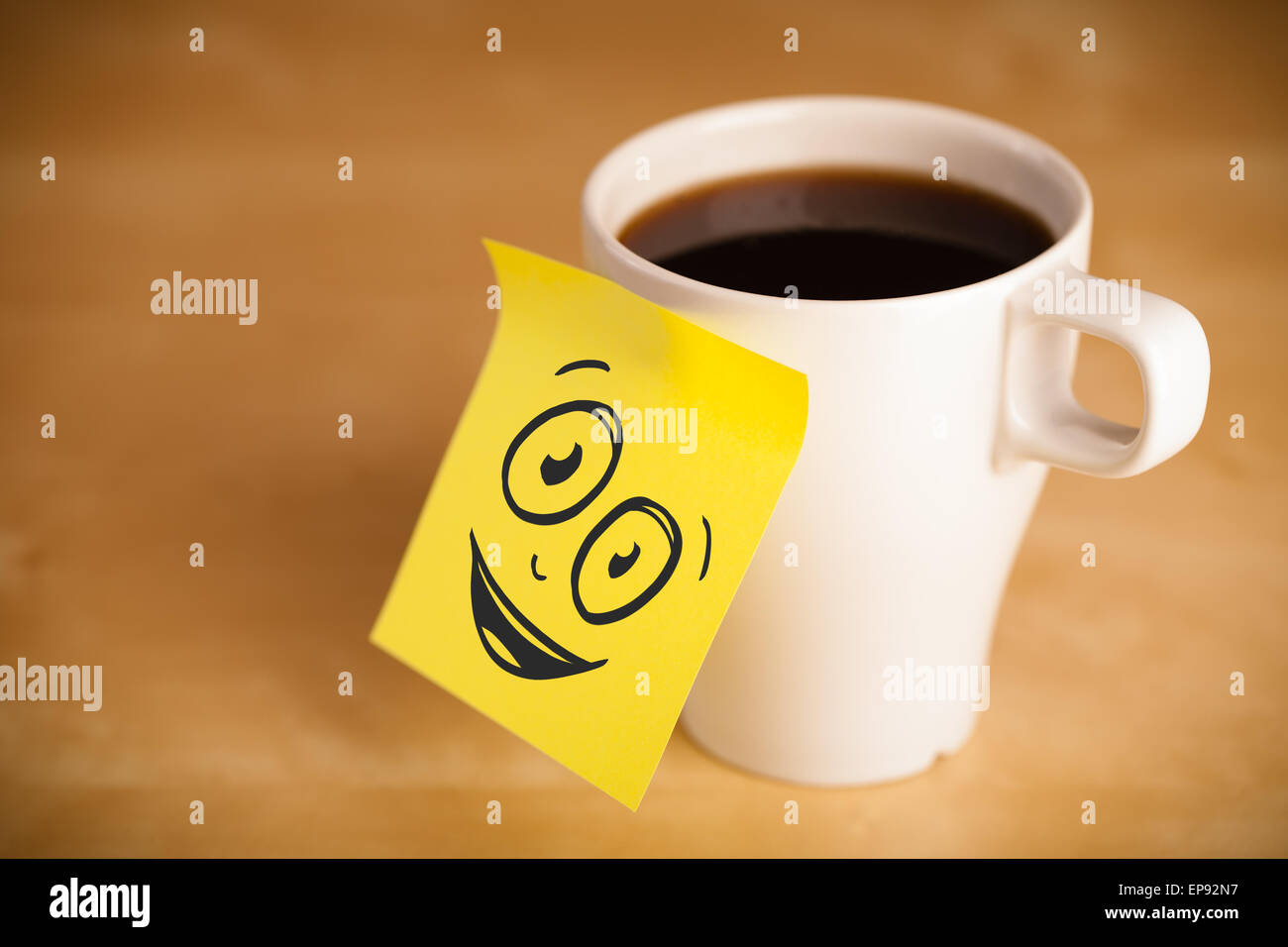 Post-it note with smiley face sticked on cup Stock Photo - Alamy