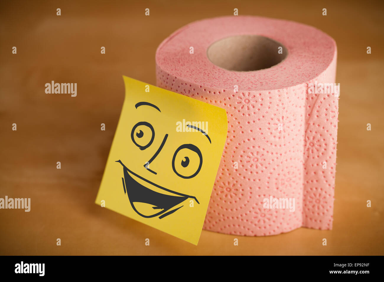 Post-it note with smiley face sticked on a toilet paper Stock Photo - Alamy