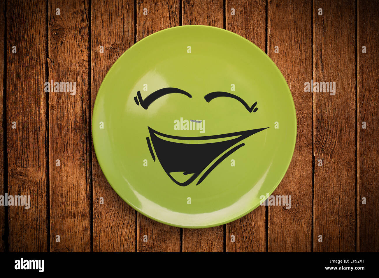 Happy smiley cartoon face on colorful dish plate Stock Photo - Alamy