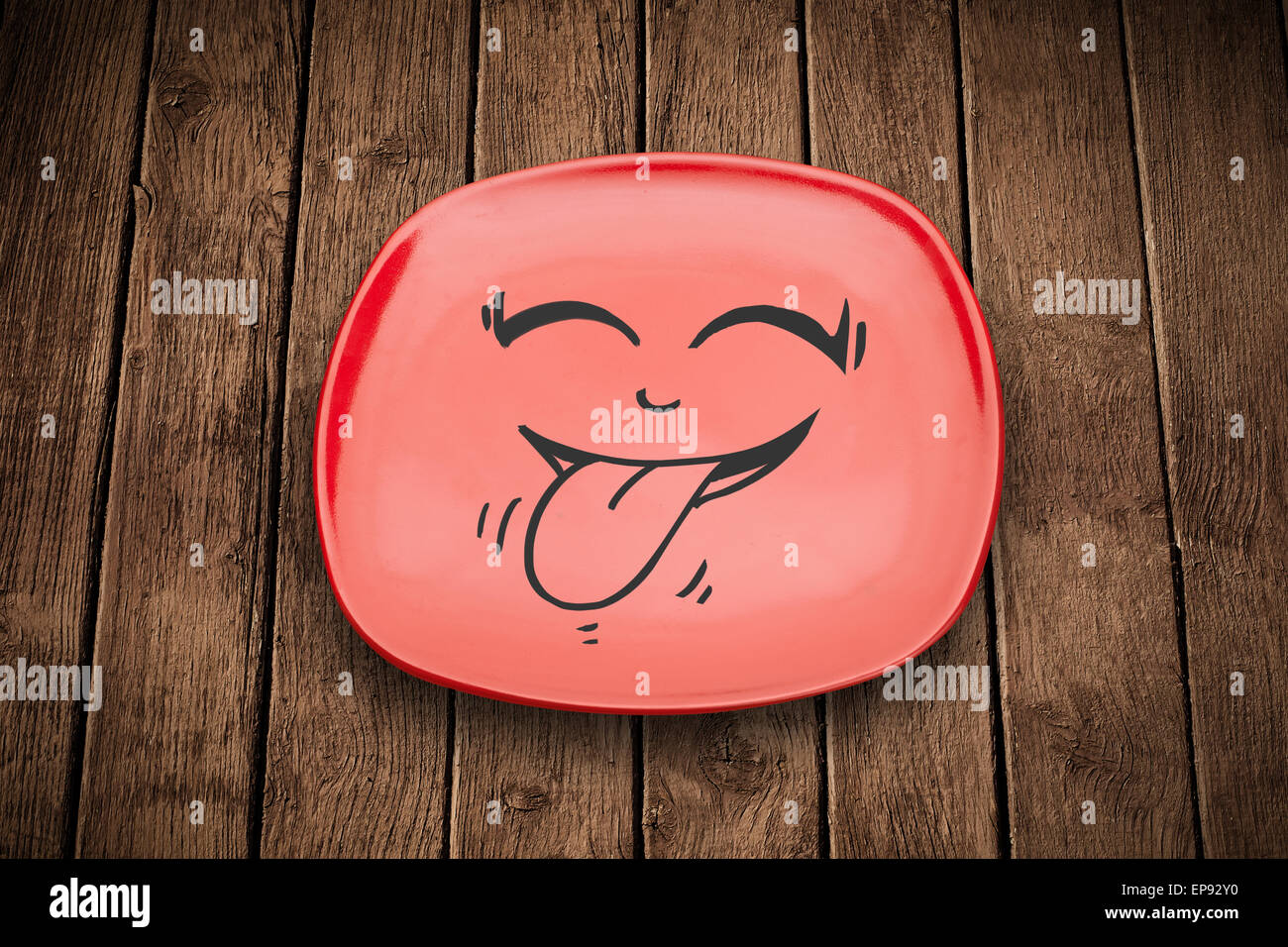 Happy smiley cartoon face on colorful dish plate Stock Photo - Alamy