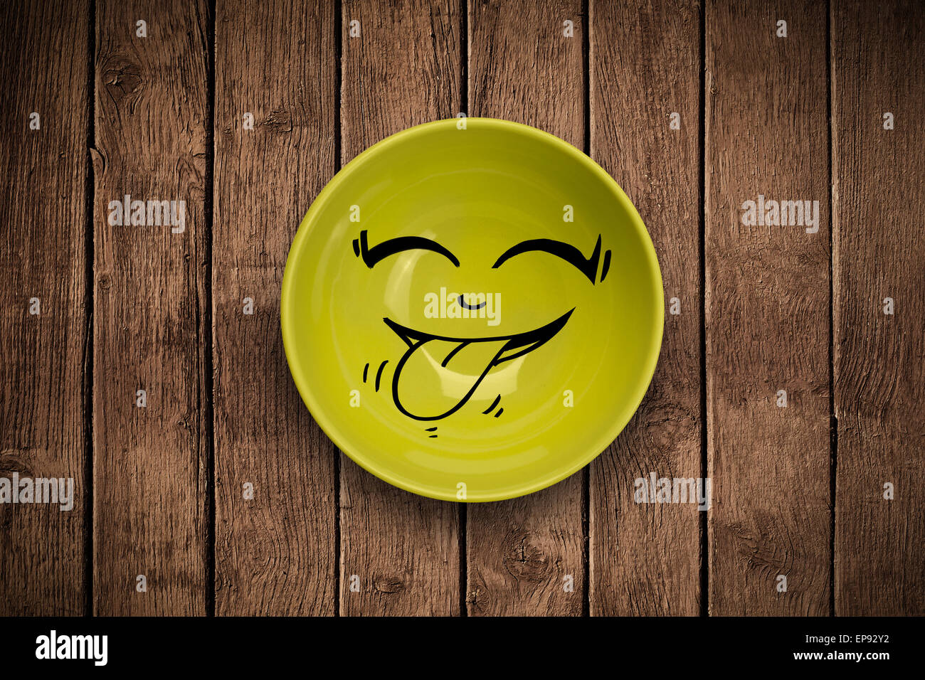 Happy smiley cartoon face on colorful dish plate Stock Photo - Alamy