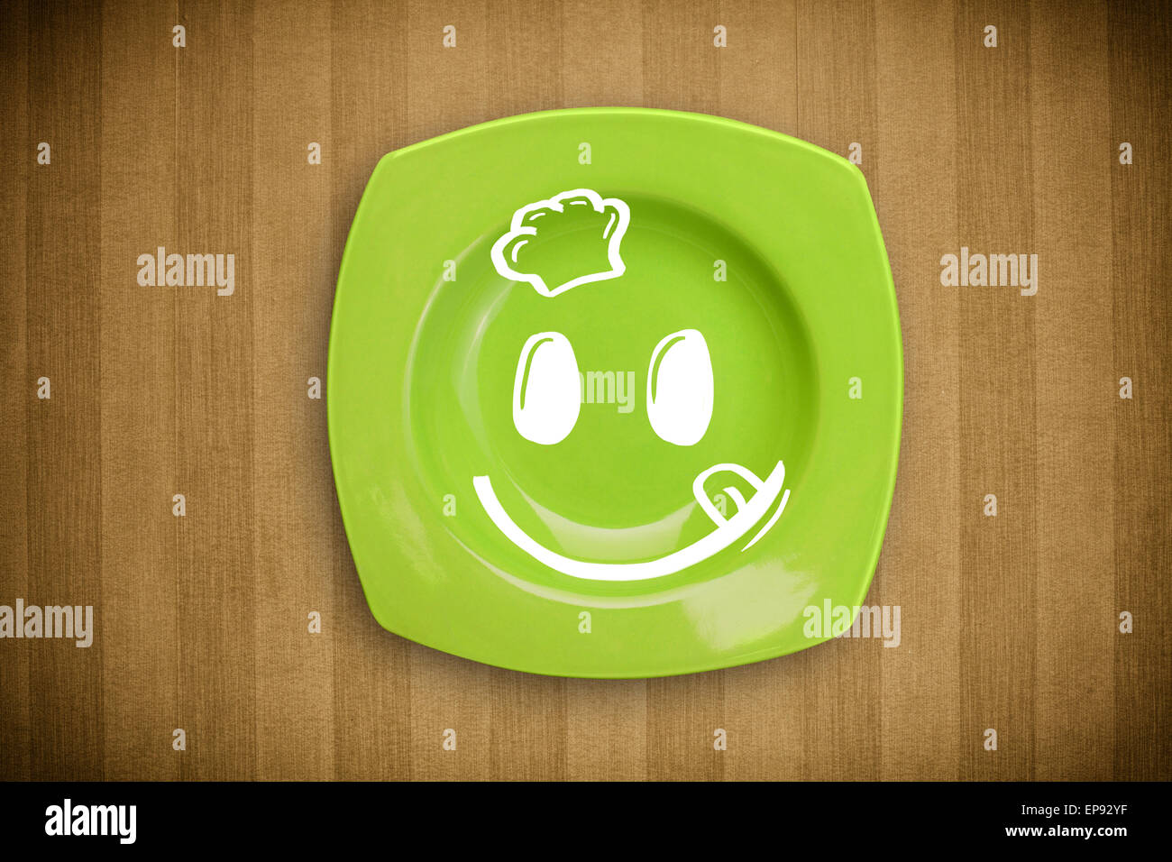 Happy smiley cartoon face on colorful dish plate Stock Photo - Alamy