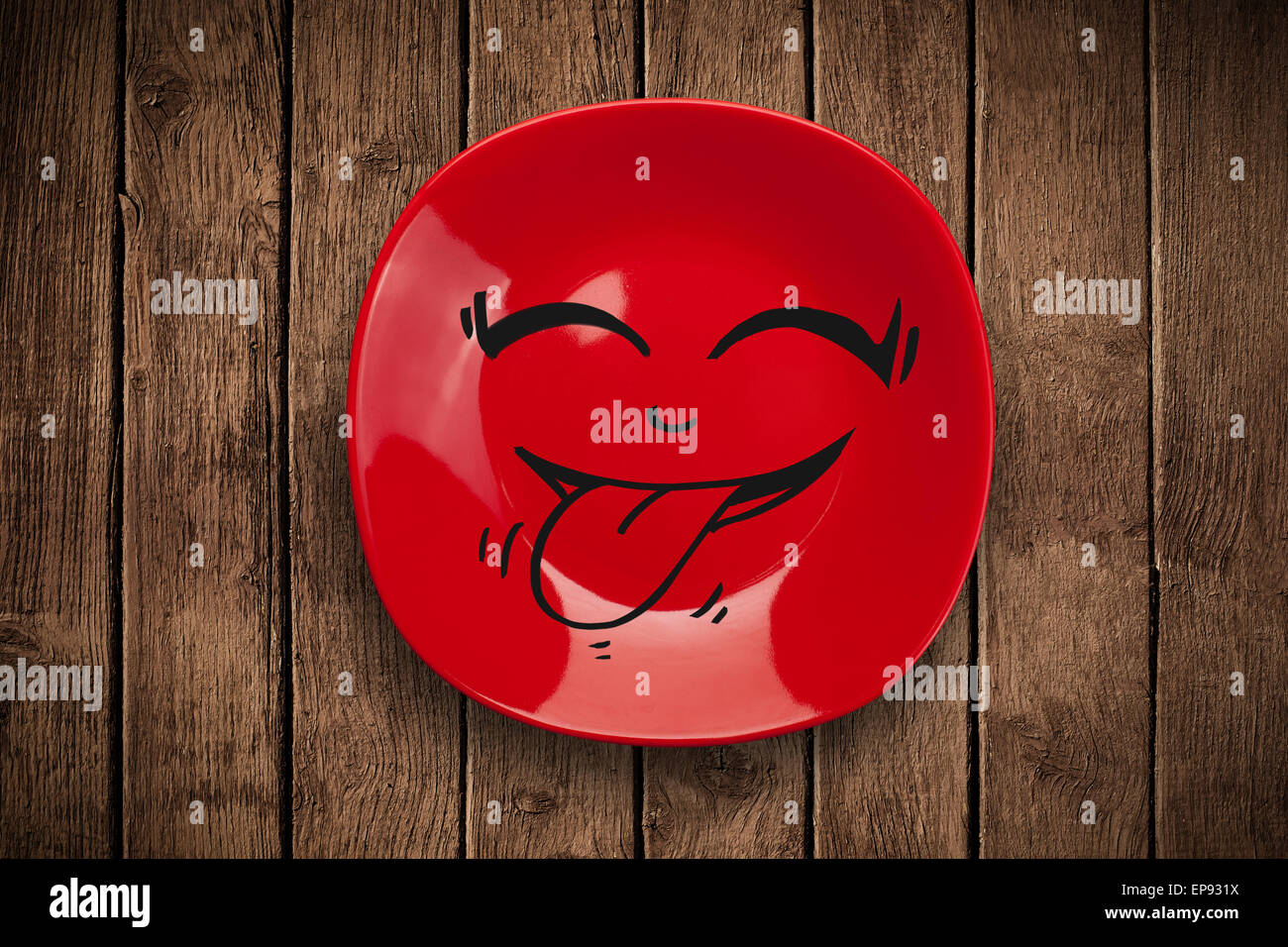 Happy smiley cartoon face on colorful dish plate Stock Photo - Alamy