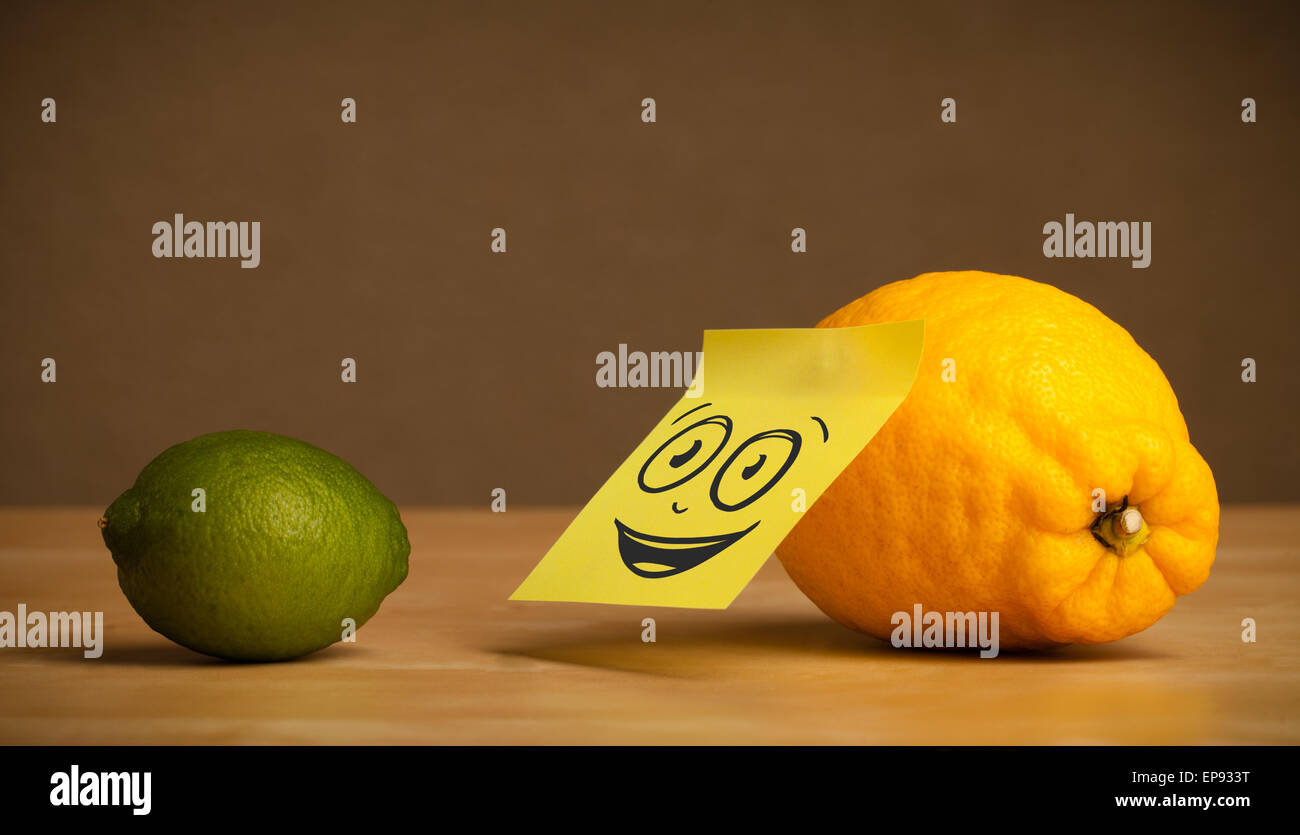 Lemon with post-it note watching at lime Stock Photo - Alamy