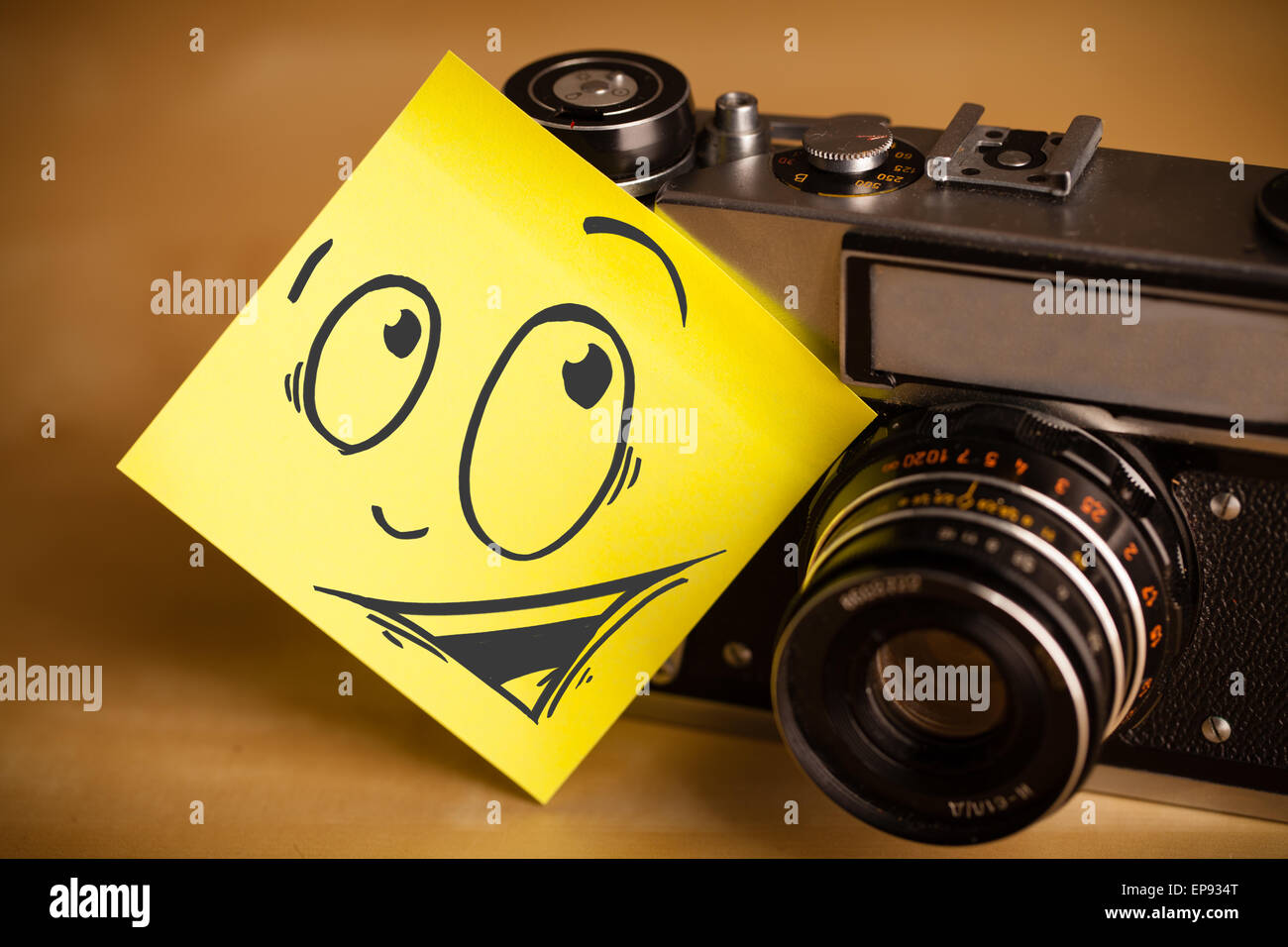 Post-it note with smiley face sticked on photo camera Stock Photo - Alamy