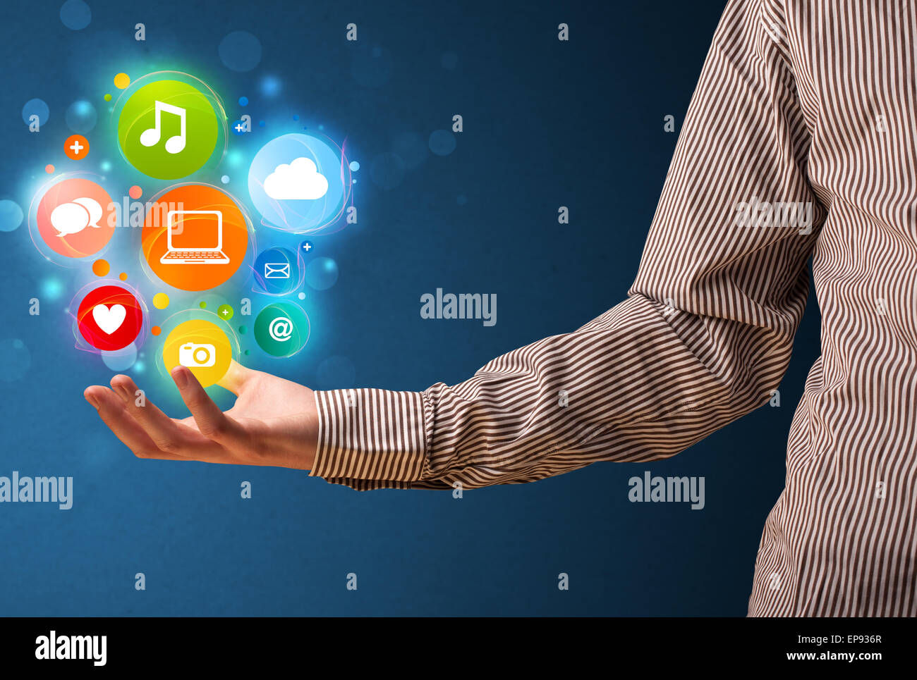 Multimedia icons in the hand of a businessman Stock Photo - Alamy
