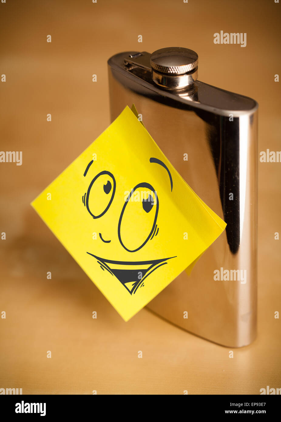 Post-it note with smiley face sticked on hip flask Stock Photo - Alamy