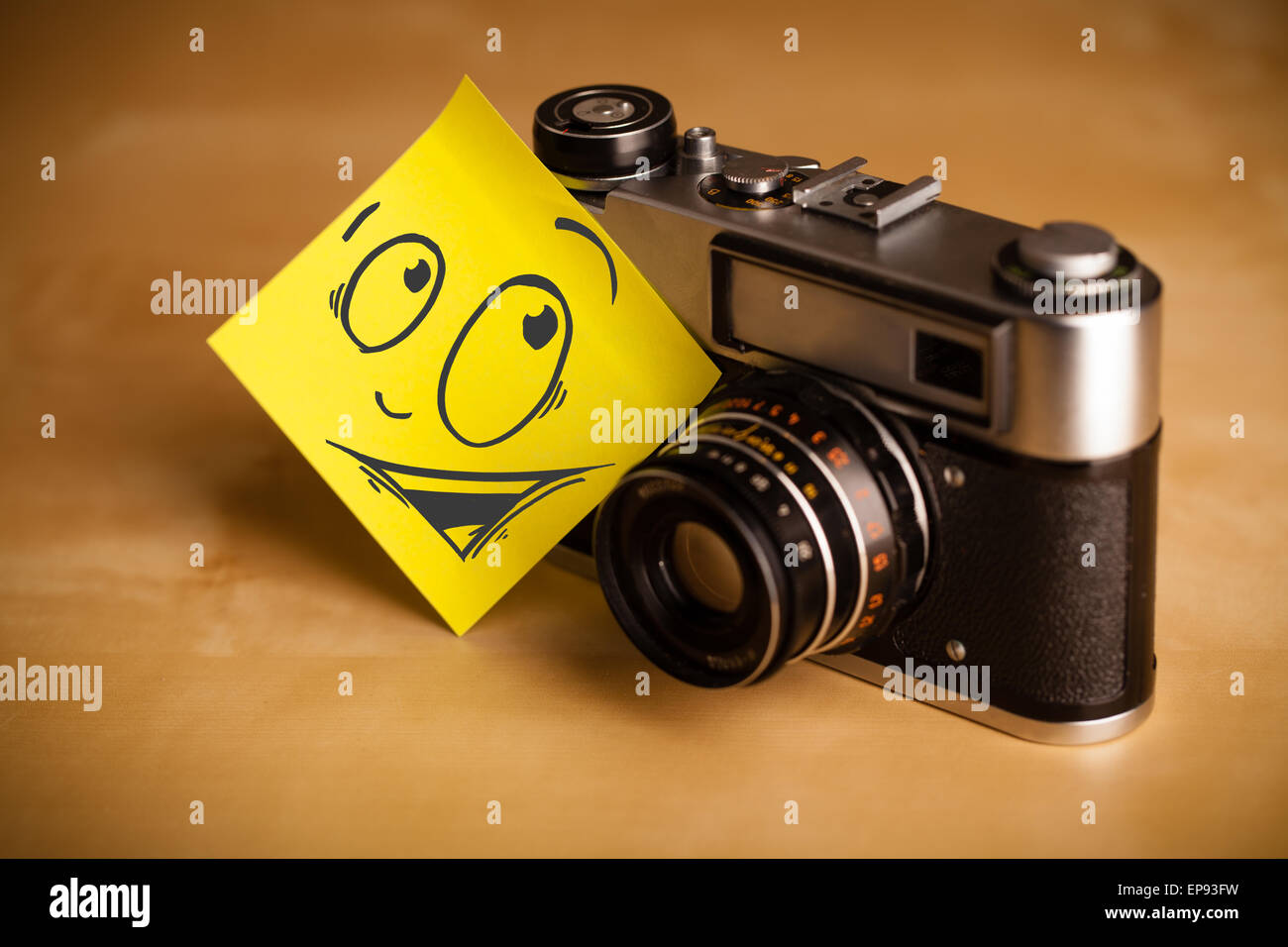 Post-it note with smiley face sticked on photo camera Stock Photo - Alamy