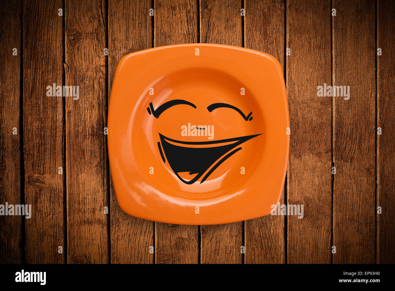 Happy smiley cartoon face on colorful dish plate Stock Photo - Alamy