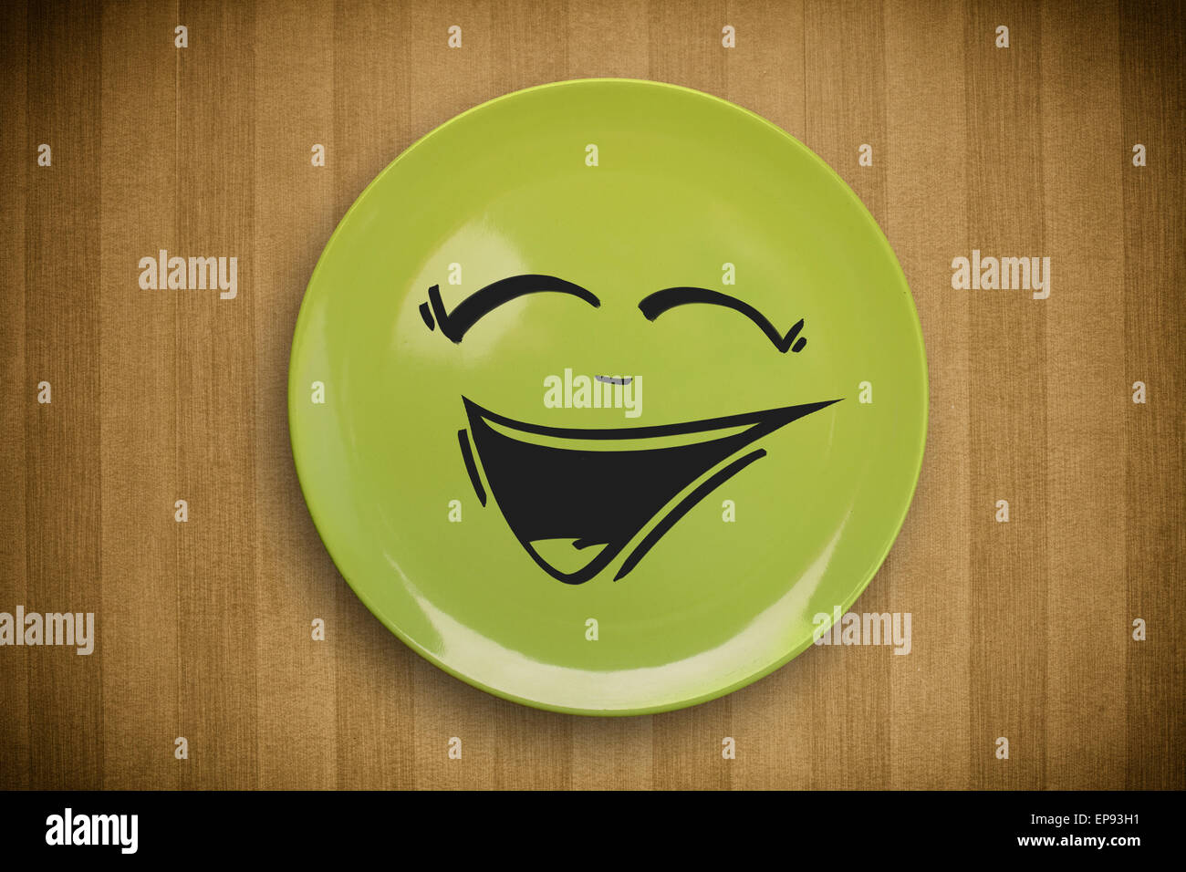 Happy smiley cartoon face on colorful dish plate Stock Photo - Alamy