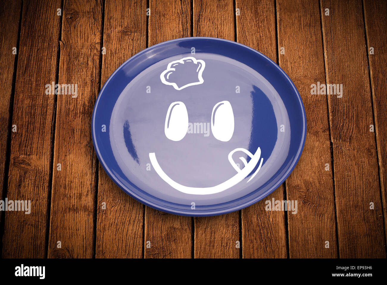 Happy smiley cartoon face on colorful dish plate Stock Photo - Alamy