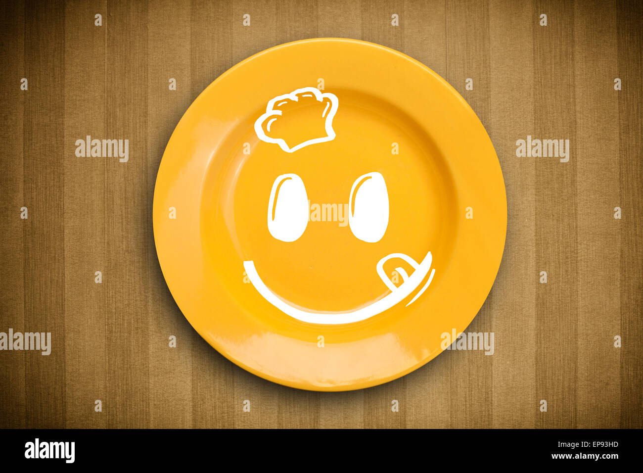 Happy smiley cartoon face on colorful dish plate Stock Photo - Alamy