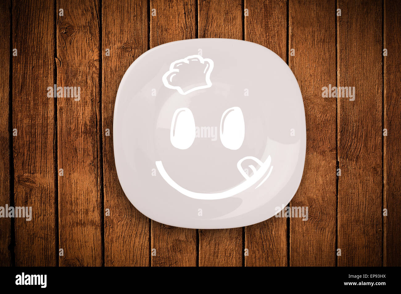 Happy smiley cartoon face on colorful dish plate Stock Photo - Alamy
