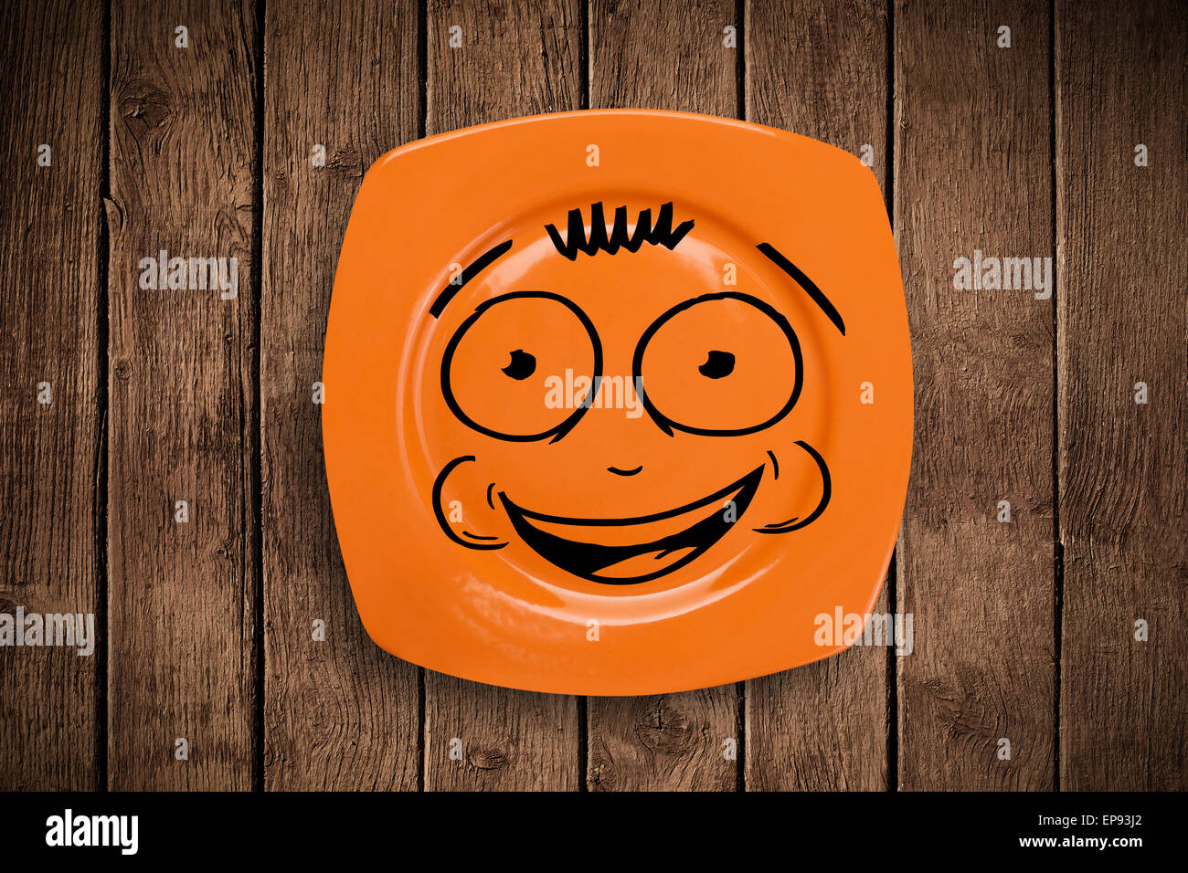 Happy smiley cartoon face on colorful dish plate Stock Photo - Alamy