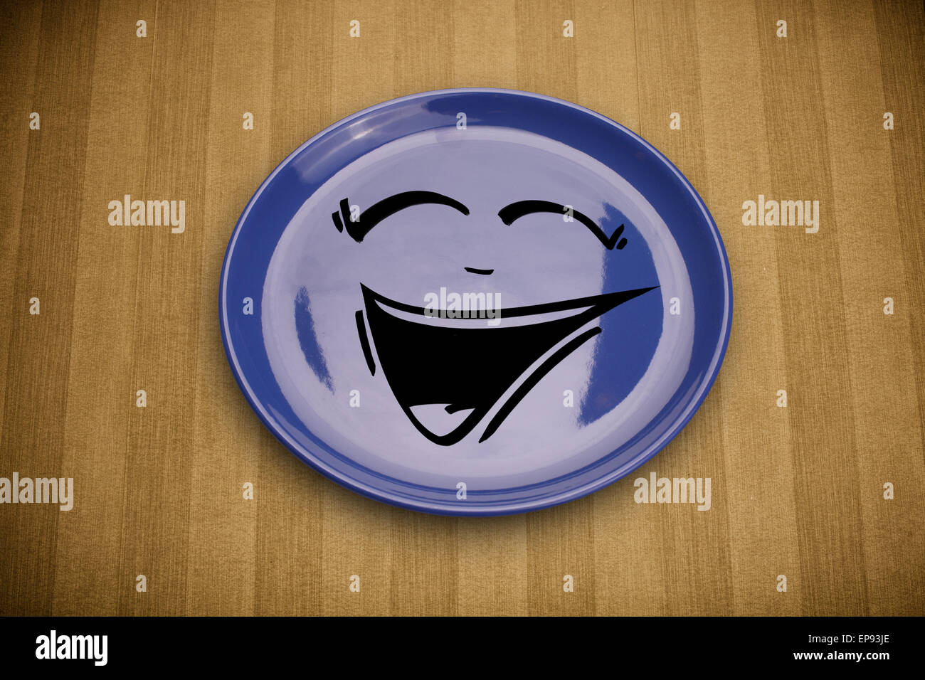 Happy smiley cartoon face on colorful dish plate Stock Photo - Alamy