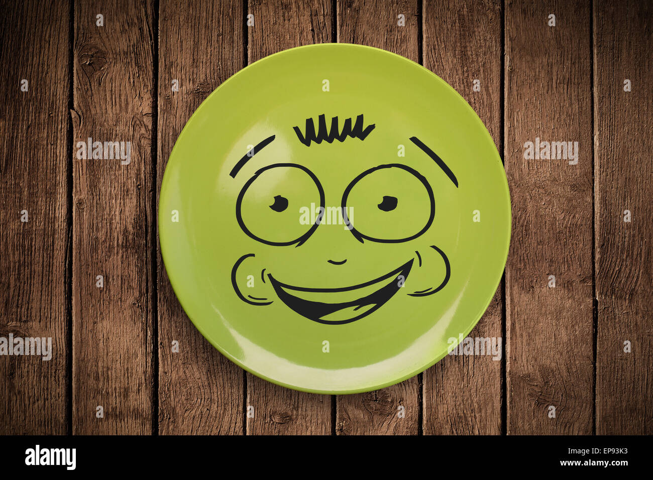 Happy smiley cartoon face on colorful dish plate Stock Photo - Alamy