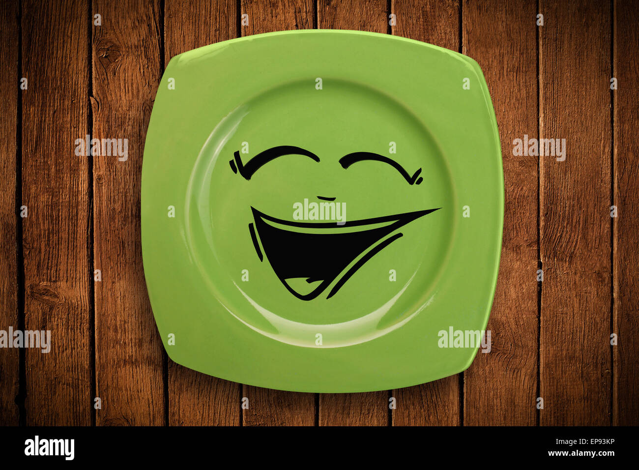 Happy smiley cartoon face on colorful dish plate Stock Photo - Alamy