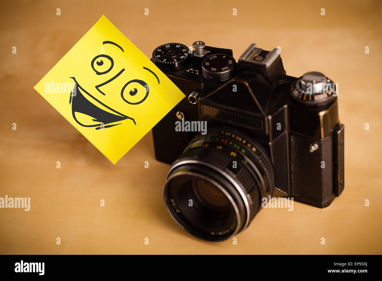 Post-it note with smiley face sticked on photo camera Stock Photo - Alamy