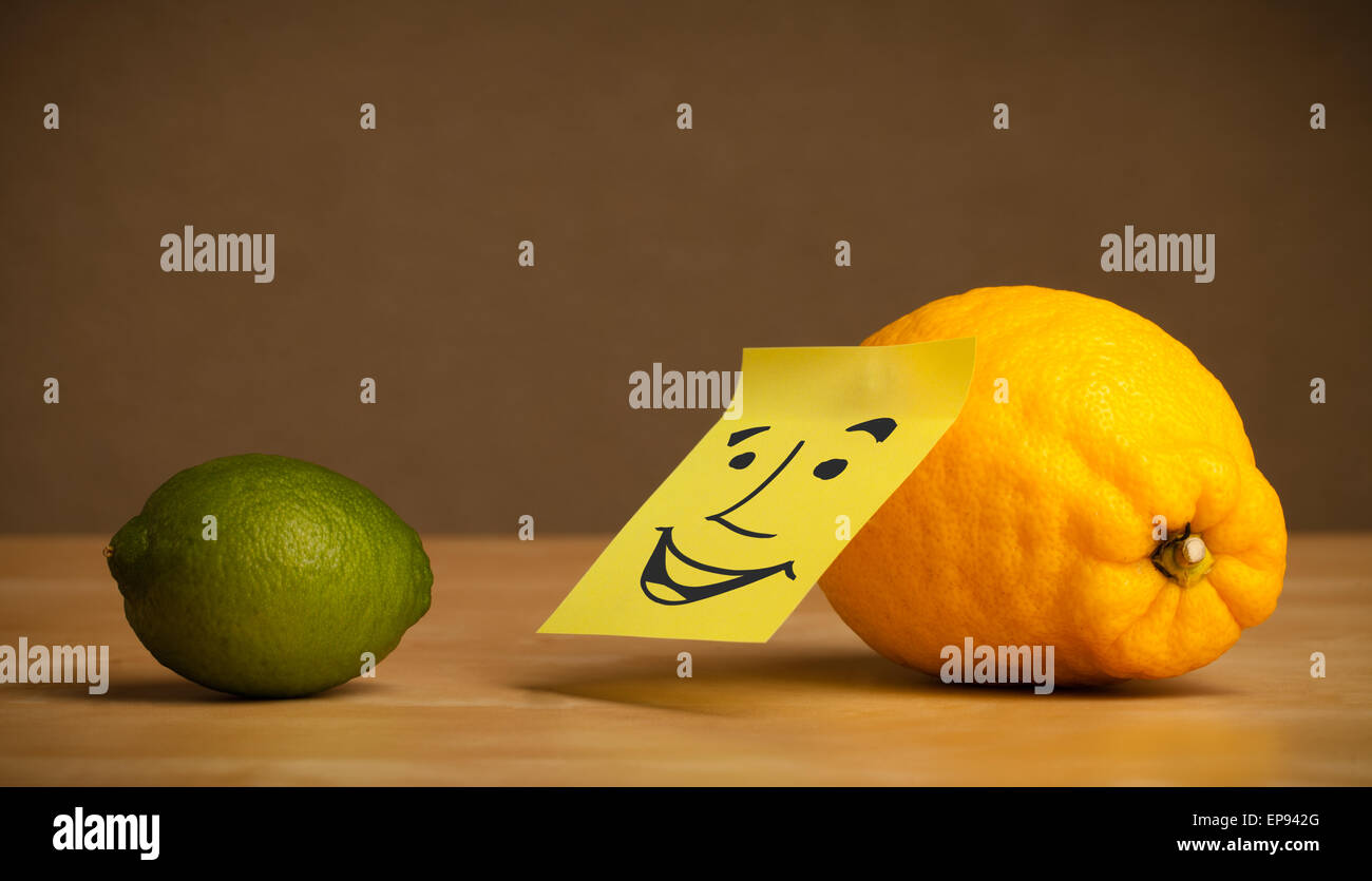 Lemon with post-it note smiling at lime Stock Photo - Alamy