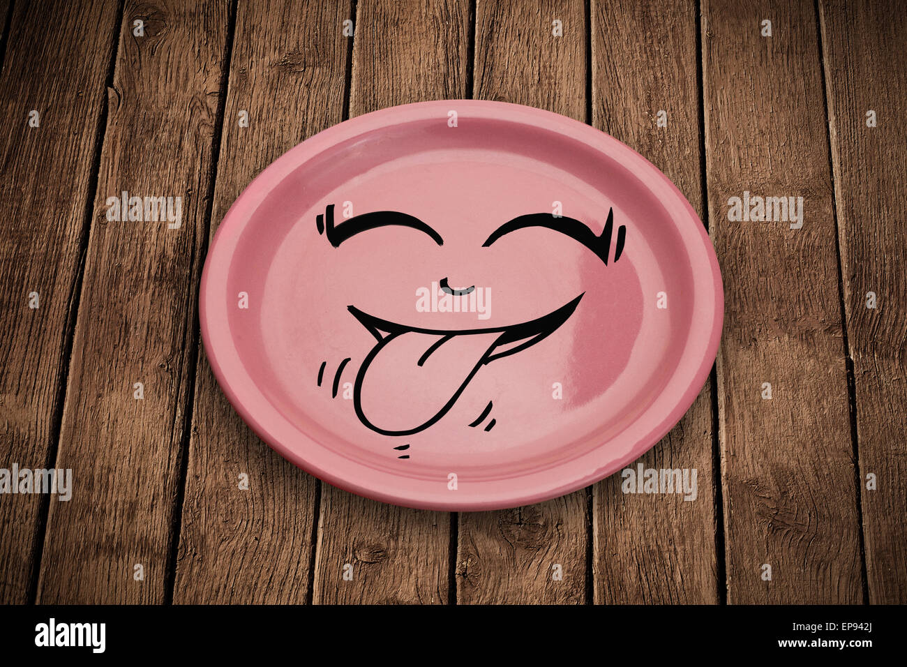 Happy smiley cartoon face on colorful dish plate Stock Photo - Alamy