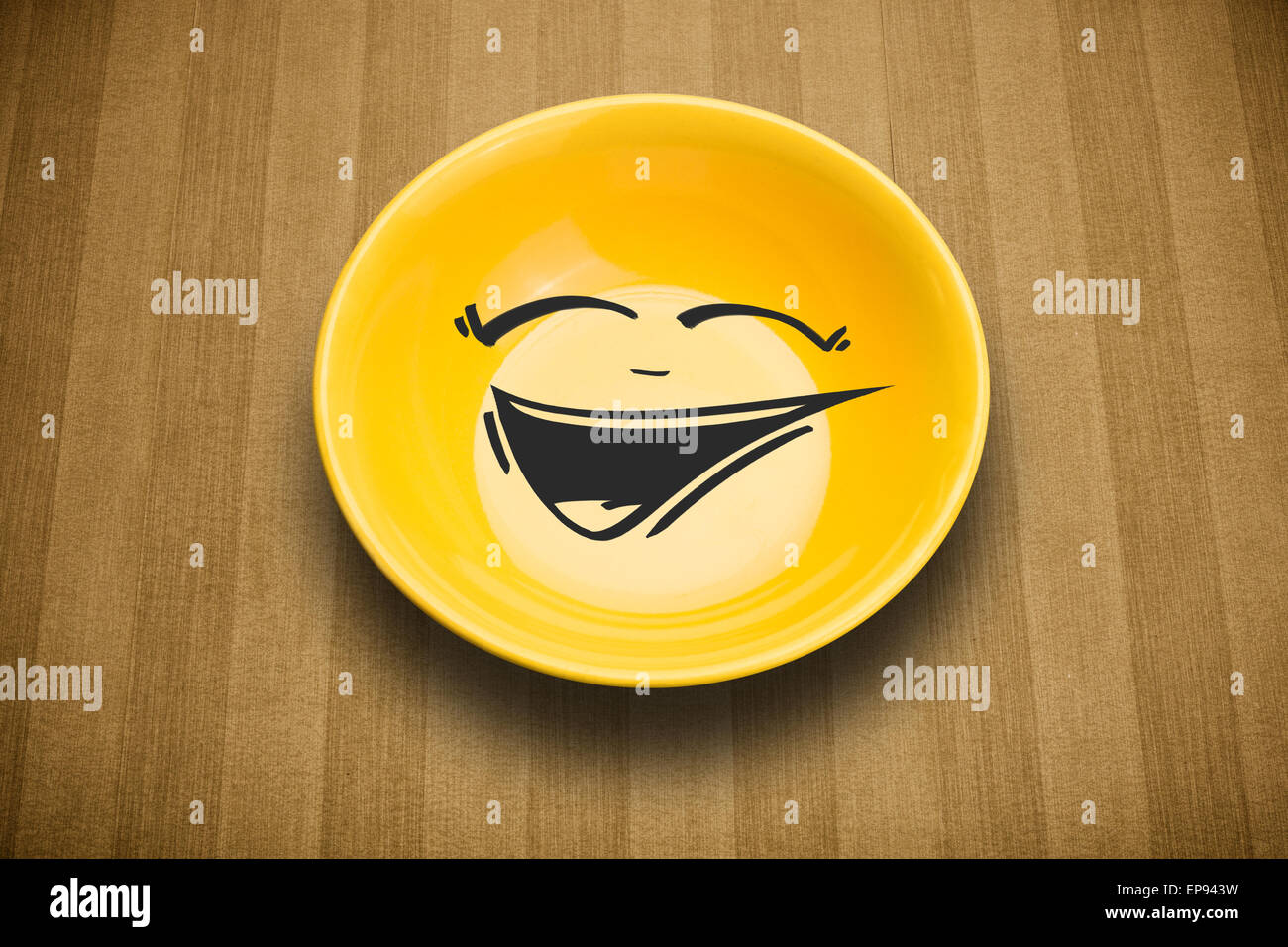 Happy smiley cartoon face on colorful dish plate Stock Photo - Alamy