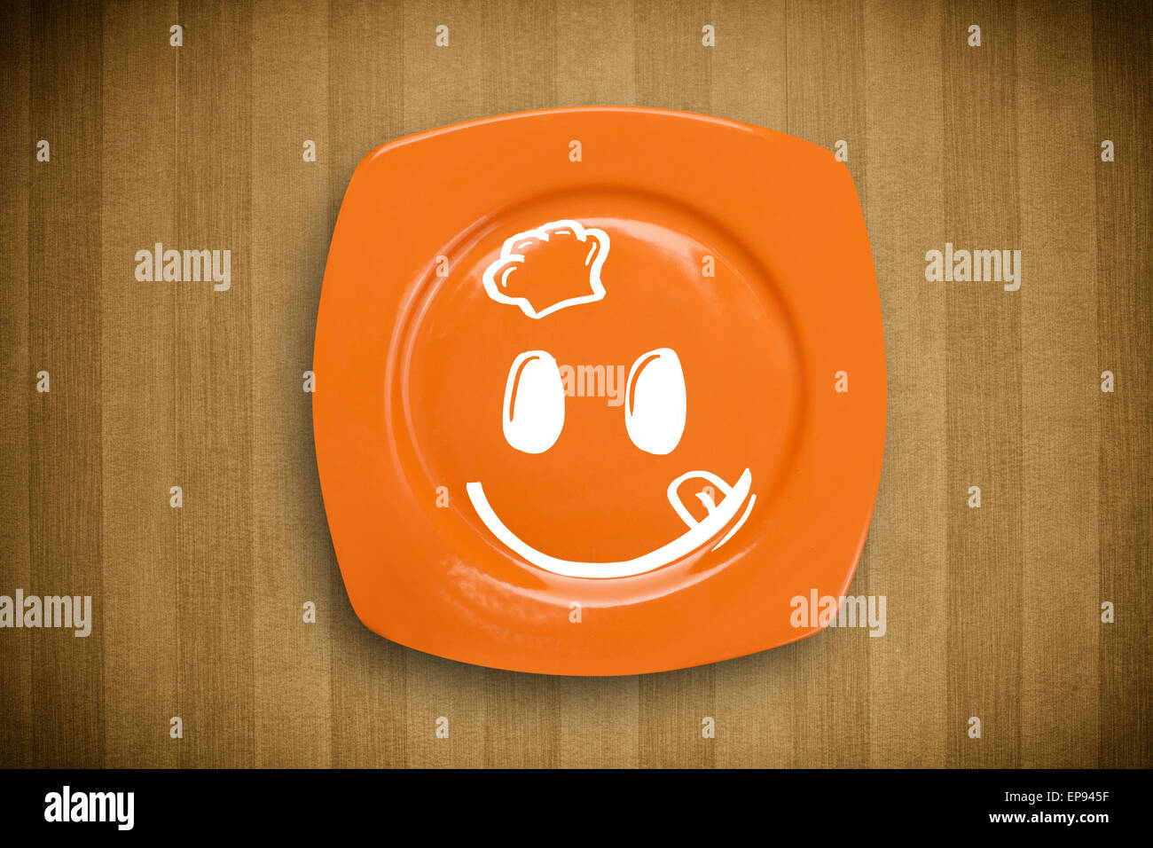 Happy smiley cartoon face on colorful dish plate Stock Photo - Alamy